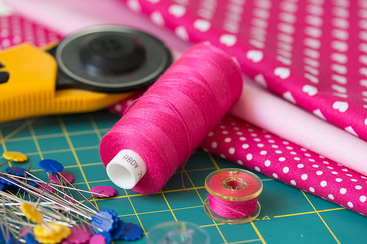 Royalty-Free photo: Pink thread with needles | PickPik